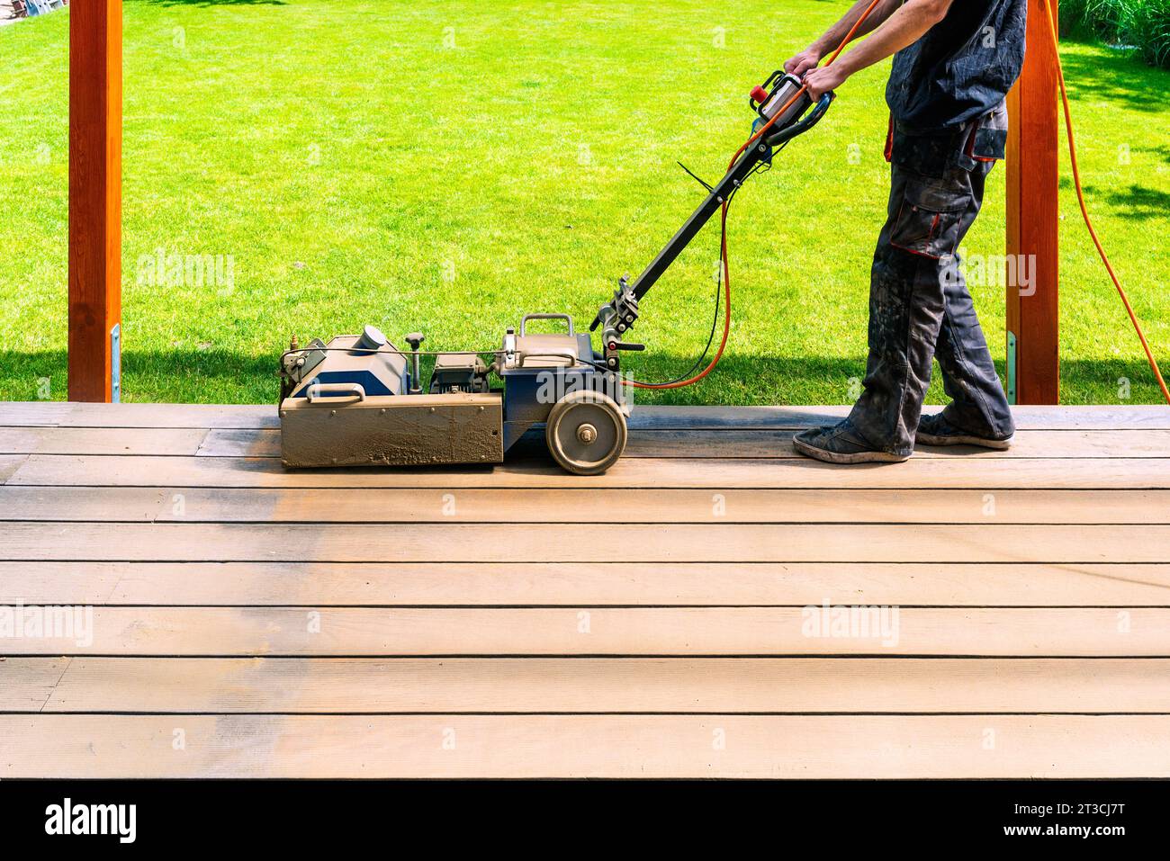 Machine cleaning of a wooden terrace - dry method - grinding the boards ...