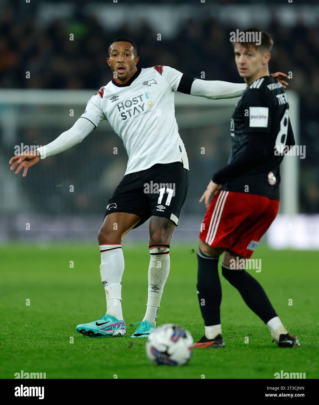 Derby County's Nathaniel Mendez-Laing battles for the ball with Exeter ...