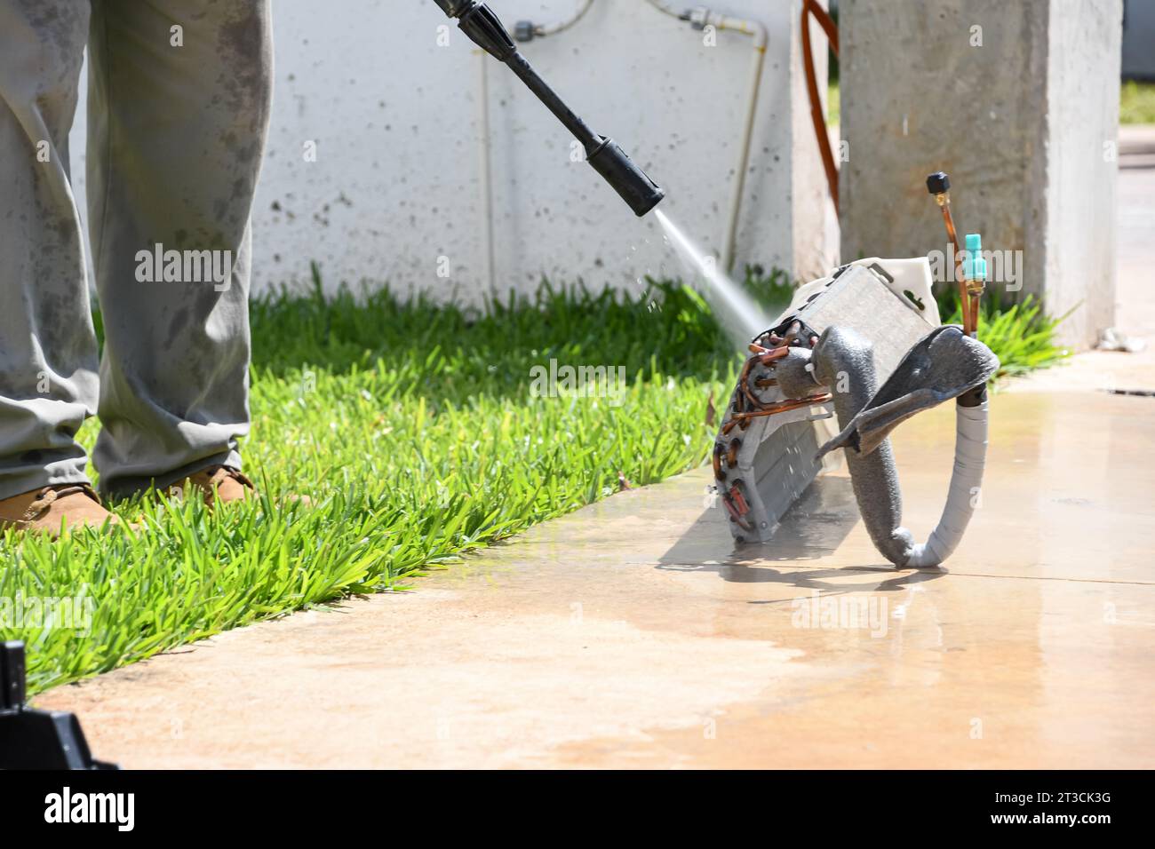 Close-up shot of the interior of an air conditioner being cleaned with ...