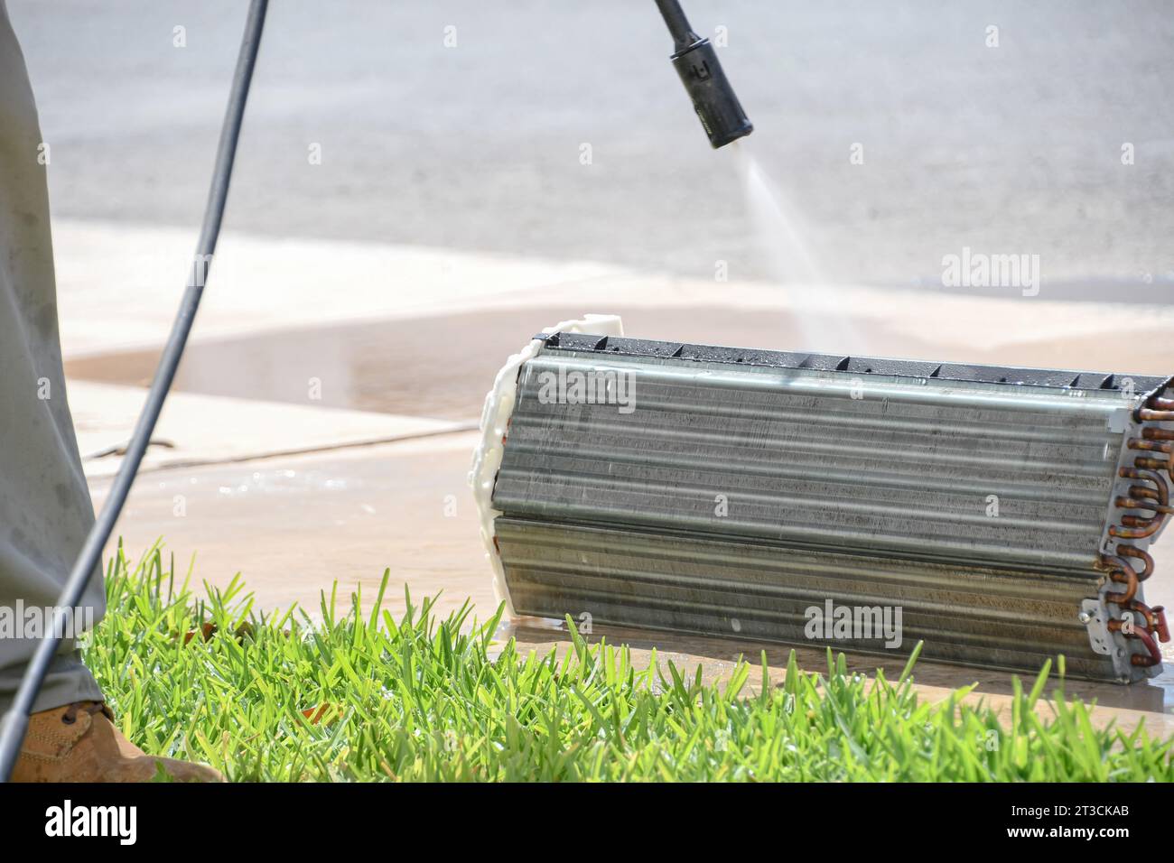 Close-up shot of the interior of an air conditioner being cleaned with ...