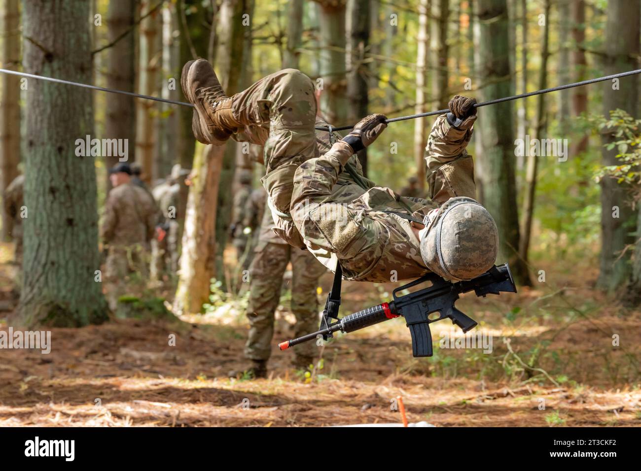 Unidentified Army soldiers training to cross a river tyrolean rope ...