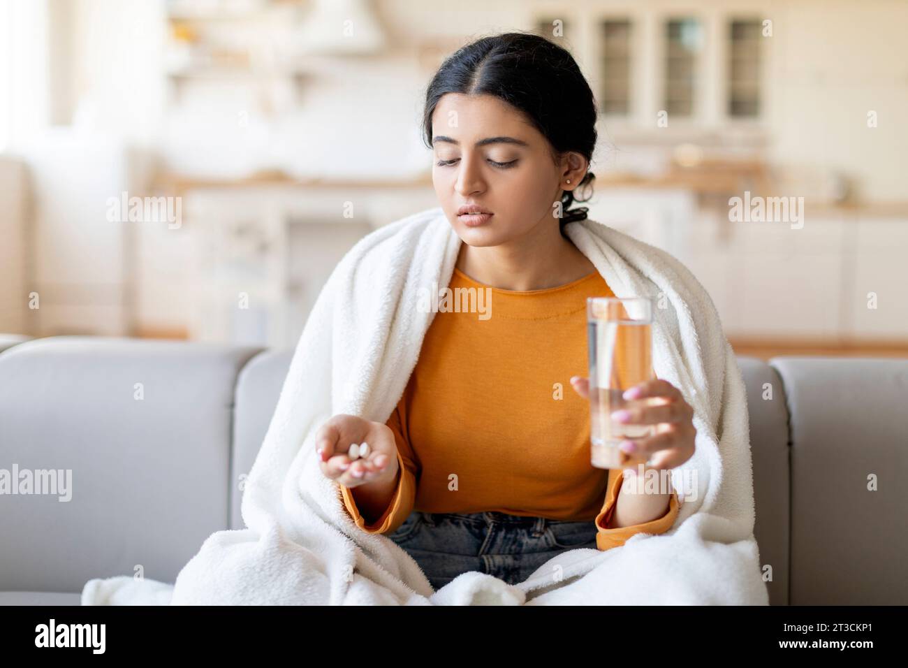 Sick Young Indian Man Holding Medicine Pills And Glass Of Water Stock ...