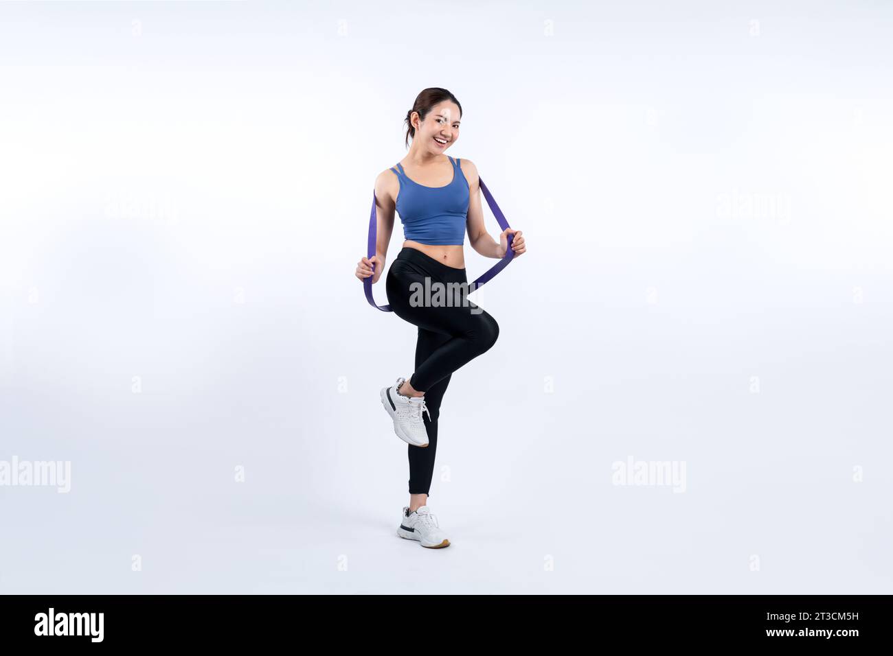 Vigorous Energetic Woman In Sportswear Portrait Stretching Resistance