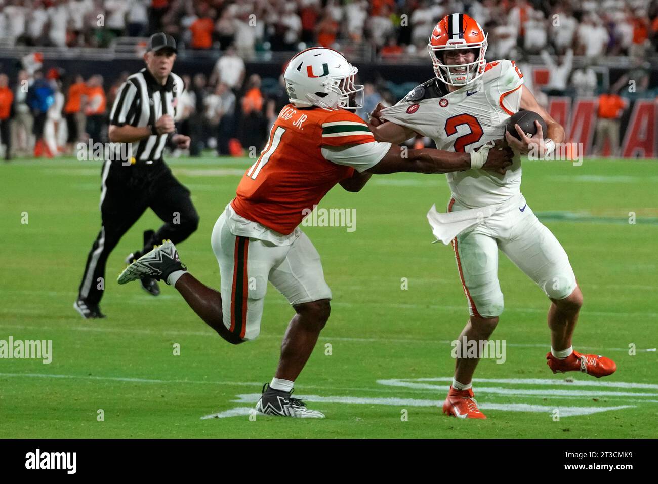 Miami linebacker Corey Flagg Jr. (11) prepares to tackle Clemson ...