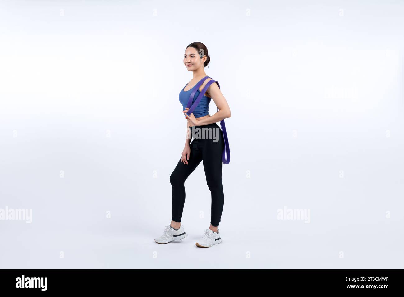 Vigorous Energetic Woman In Sportswear Portrait Stretching Resistance