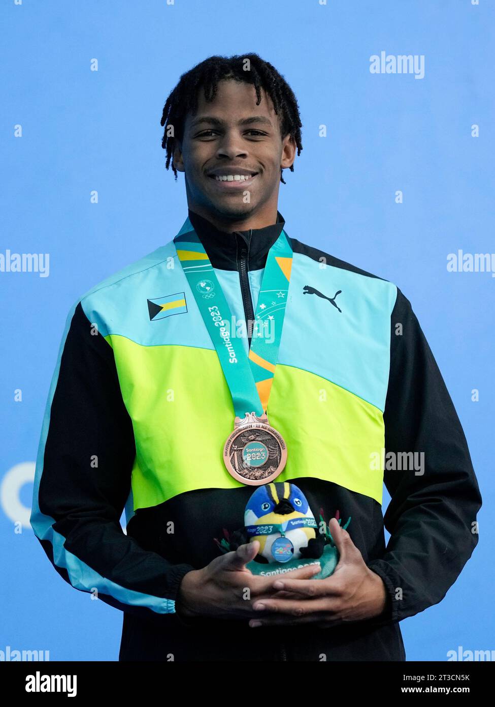 Bahamas' Lamar Taylor poses with the bronze medal at the podium of men's 50-meters freestyle at ...