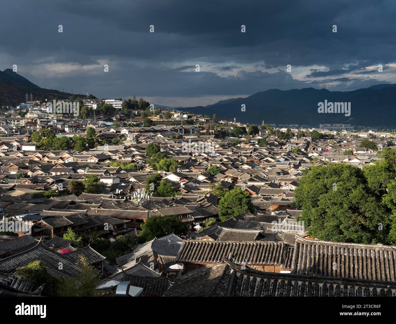 View over the Chinese rooftops of the historic old town of Lijiang ...