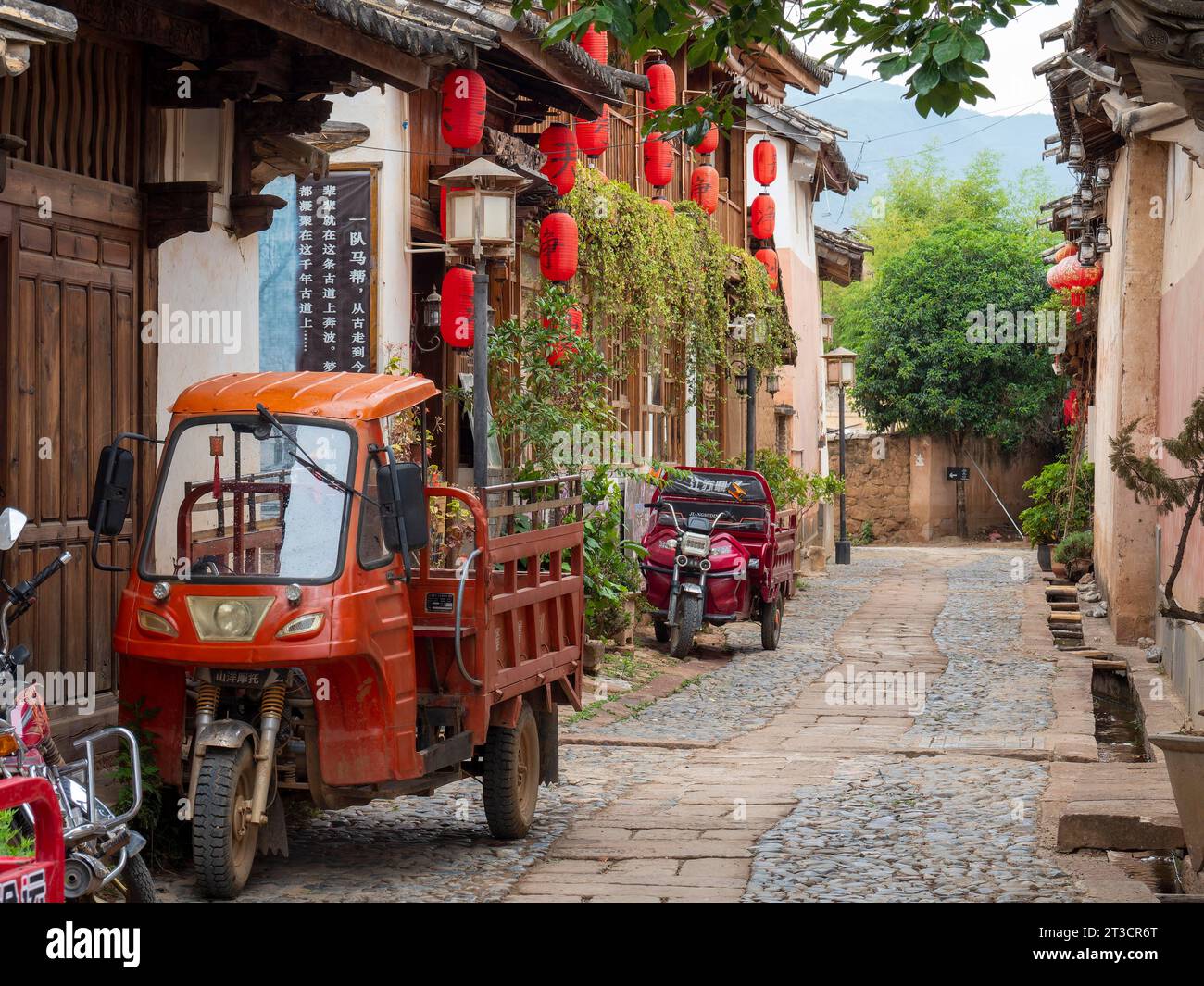Ancient Chinese houses and tricycle car in the alleys of Shaxi, Yunnan ...