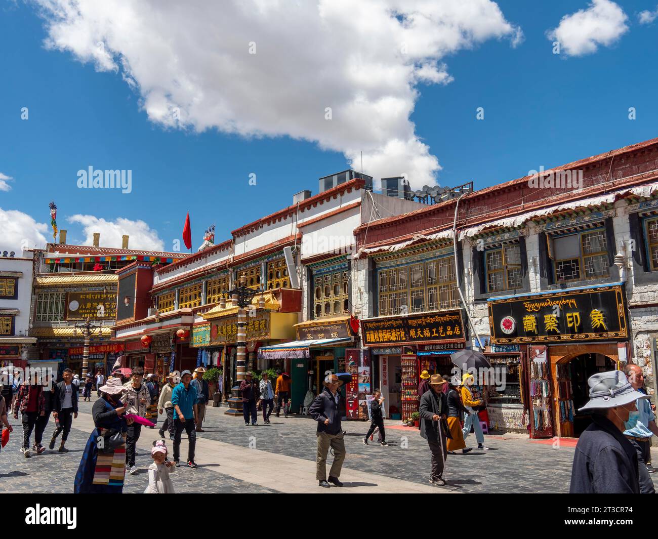 Pilgrims walk through the streets of Lhasa, Tibet, China Stock Photo ...