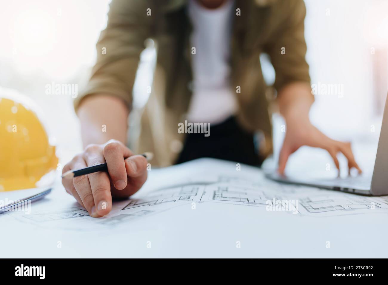 engineering department with work design structure building or house using blueprint computer at ...