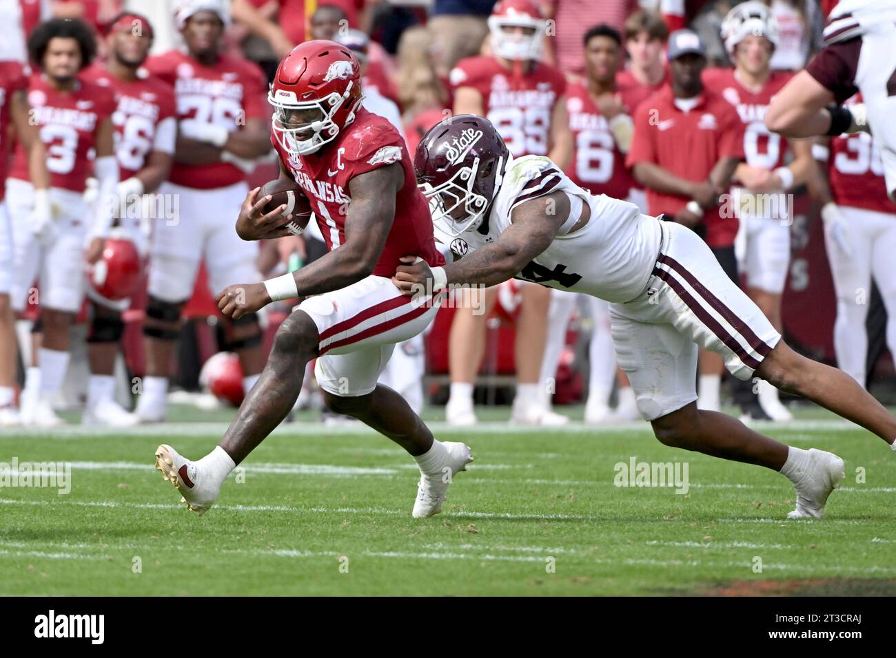 Arkansas quarterback KJ Jefferson (1) tries to slips past Mississippi ...