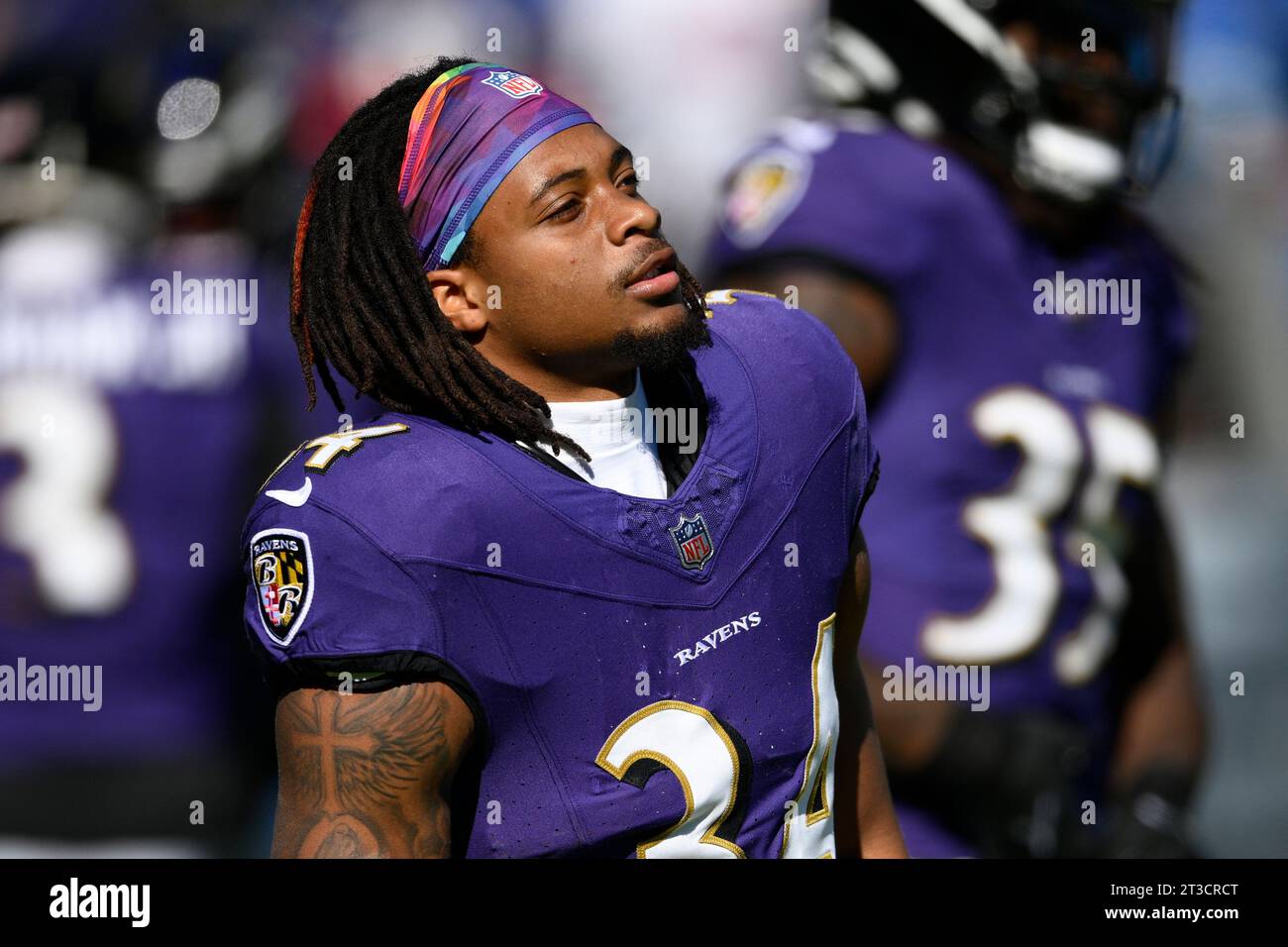 Baltimore Ravens running back Keaton Mitchell (34) works out wearing ...
