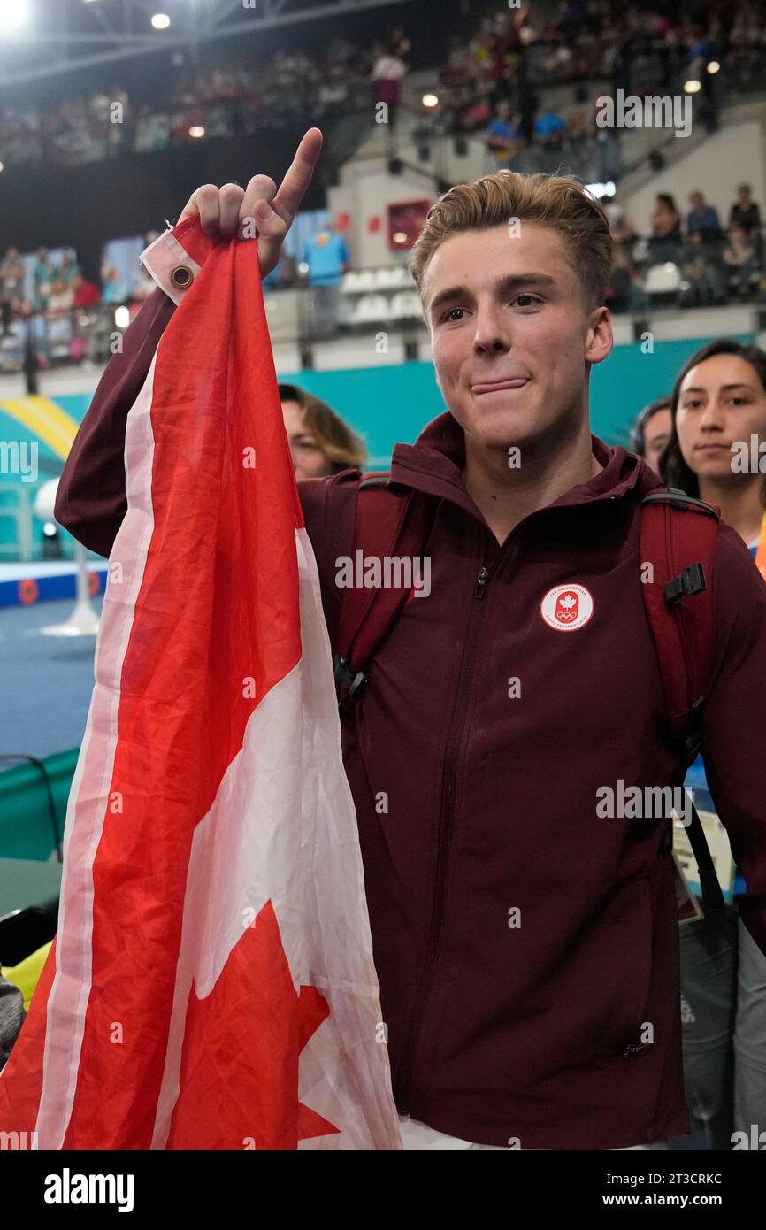 Canada's Felix Dolci holds his National flag after winning gold in the ...