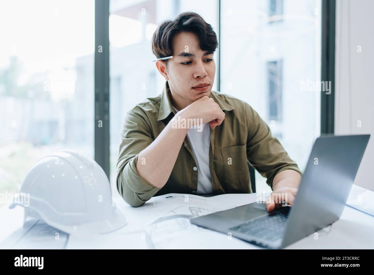 engineering department with work design structure building or house using blueprint computer at ...