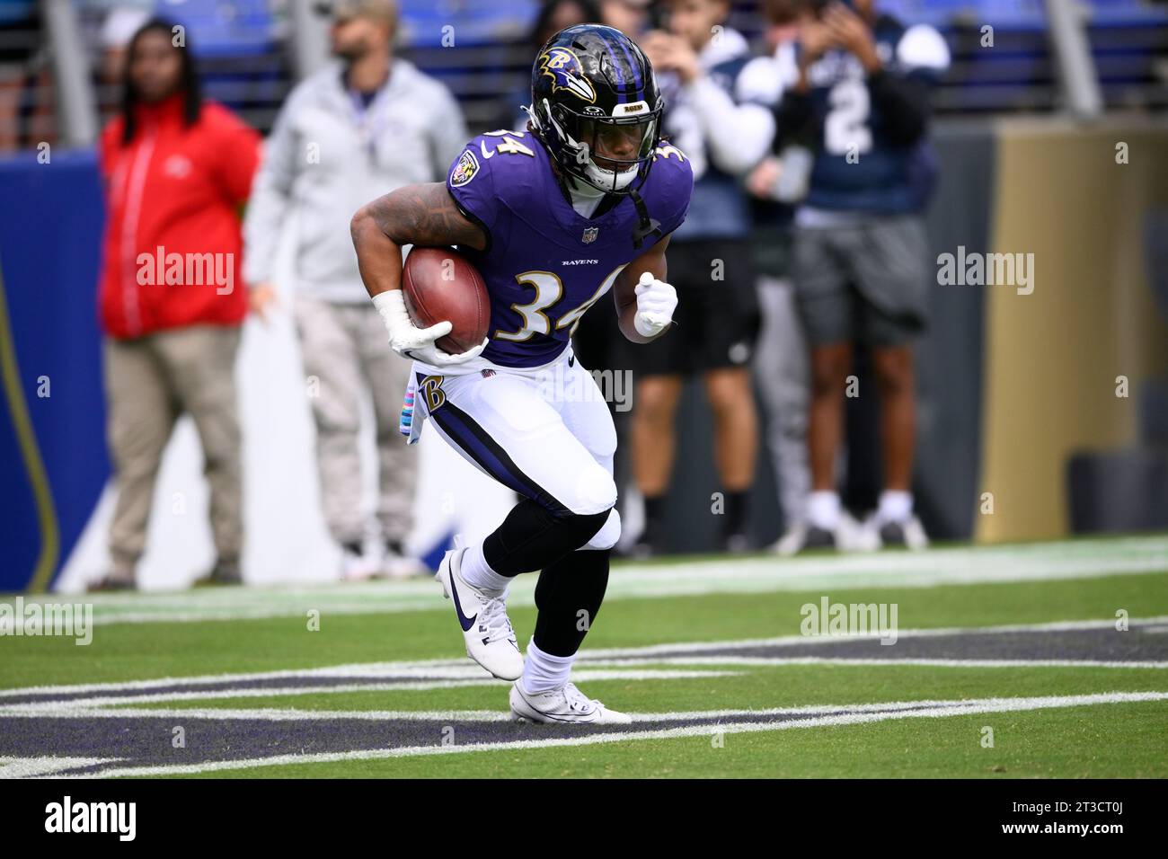 Baltimore Ravens running back Keaton Mitchell (34) works out before an ...