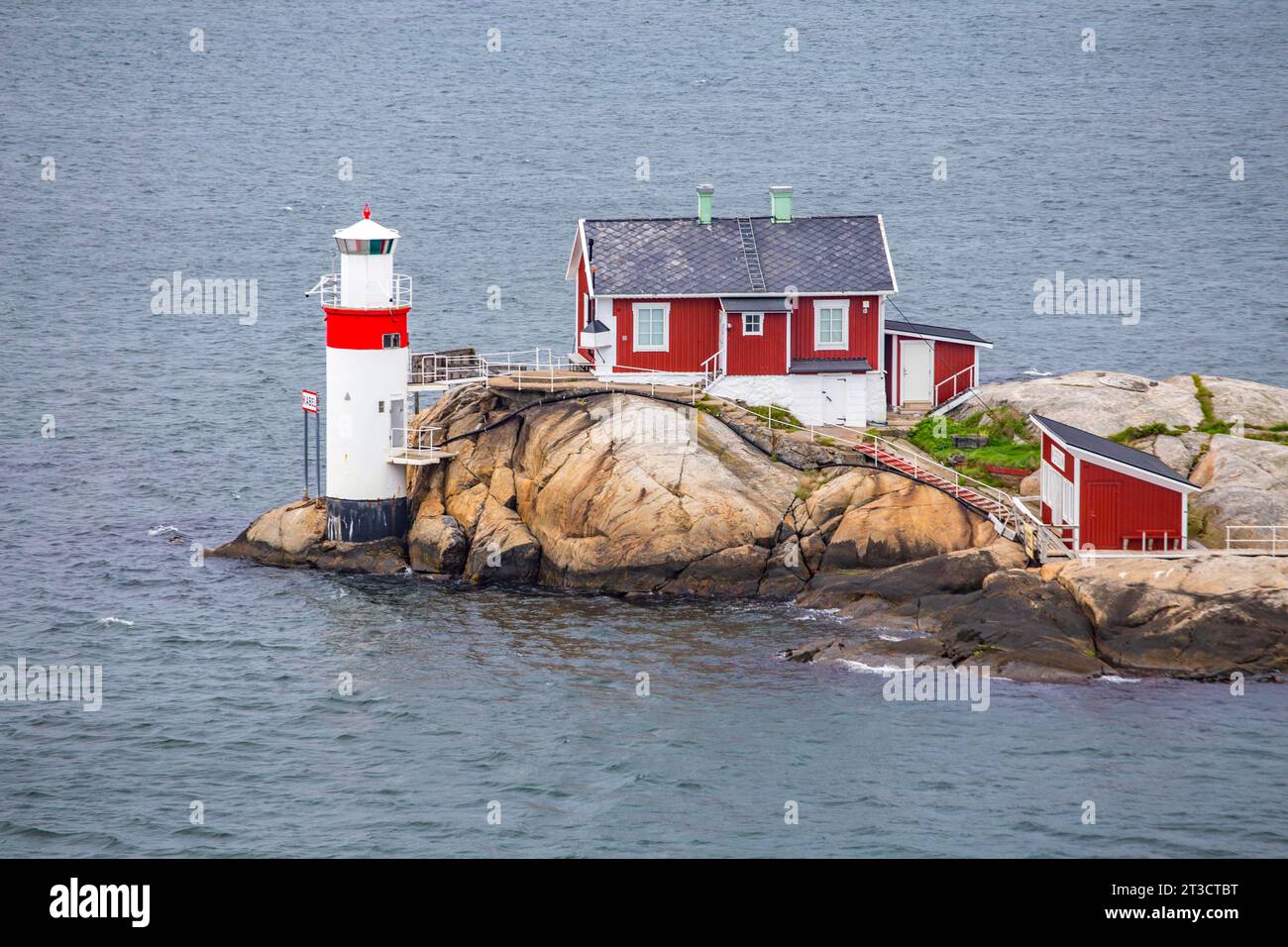 Typical tiny archipelago island with lighthouse and lighthouse keeper's ...
