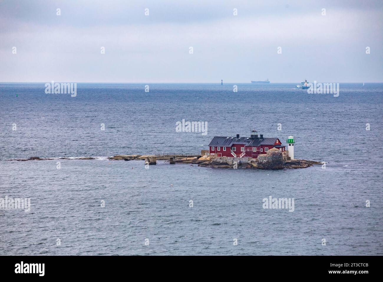 Typical tiny archipelago island with lighthouse and lighthouse keeper's ...