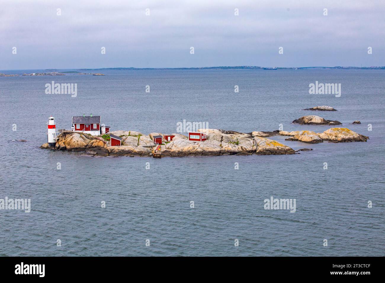 Typical tiny archipelago island with lighthouse and lighthouse keeper's ...