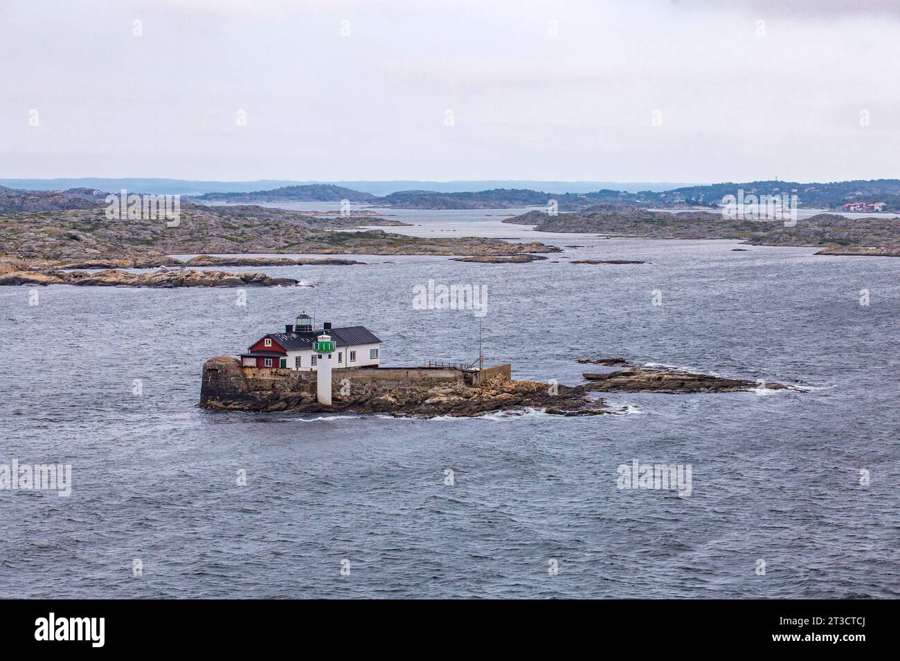 Typical tiny archipelago island with lighthouse and lighthouse keeper's ...