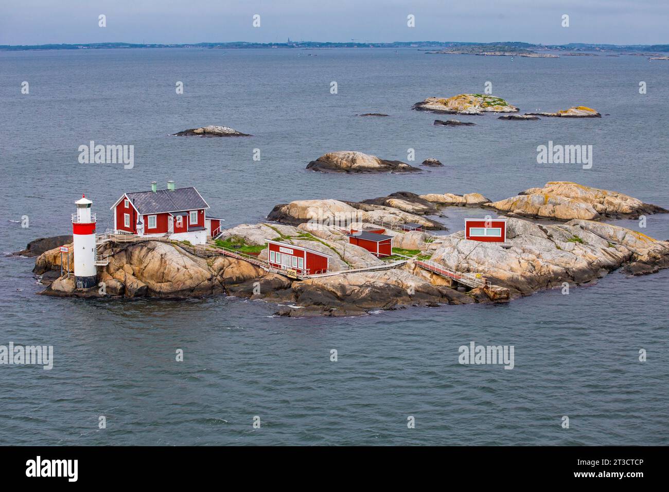 Typical tiny archipelago island with lighthouse and lighthouse keeper's ...
