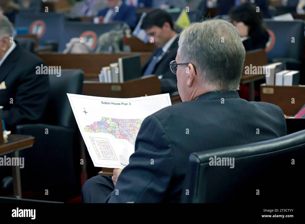 Rep. Mitchell S. Setzer, R- Catawba, looks over a proposed map of ...