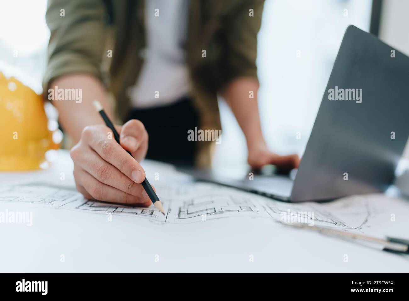 engineering department with work design structure building or house using blueprint computer at ...