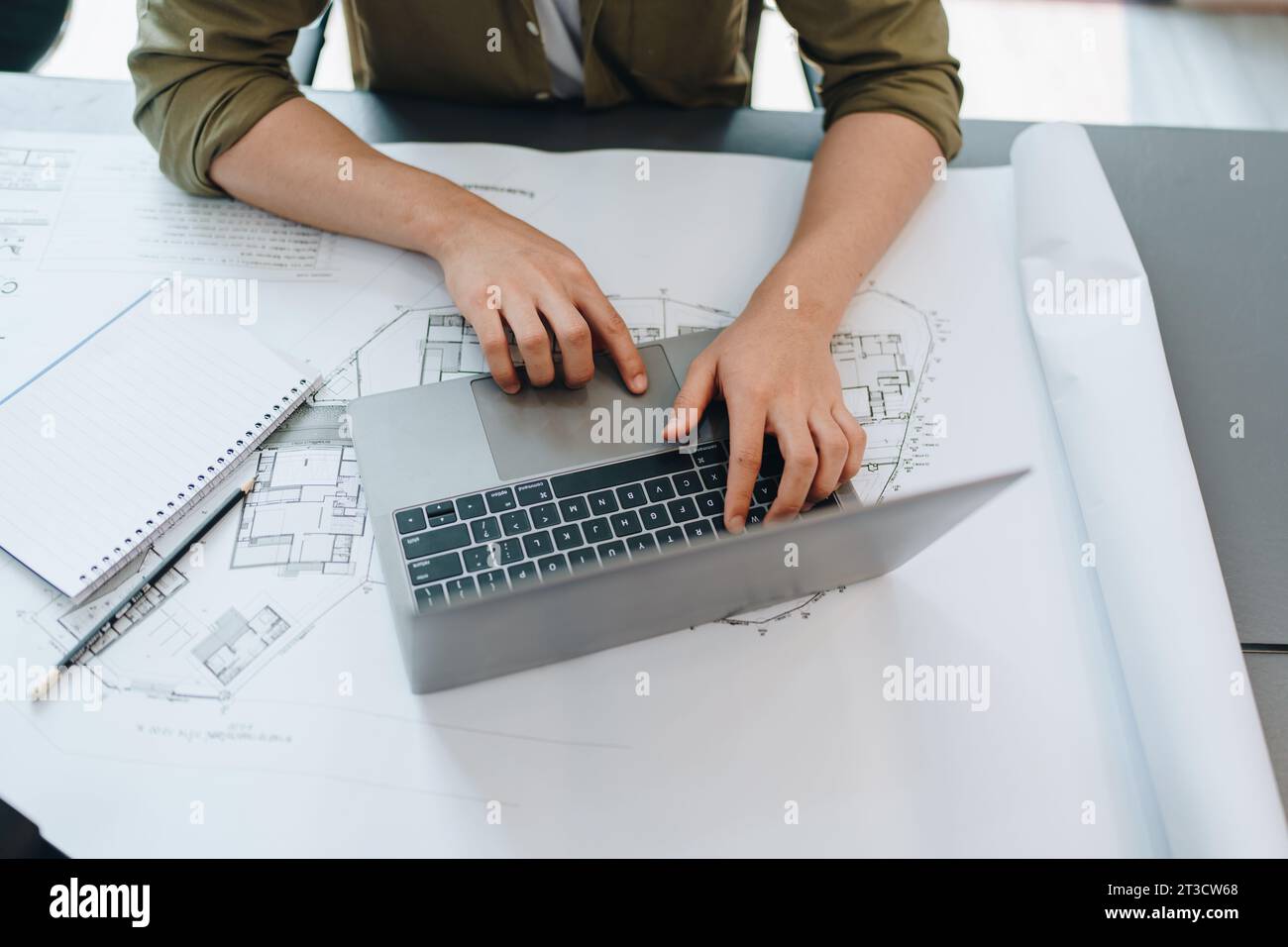 engineering department with work design structure building or house using blueprint computer at ...