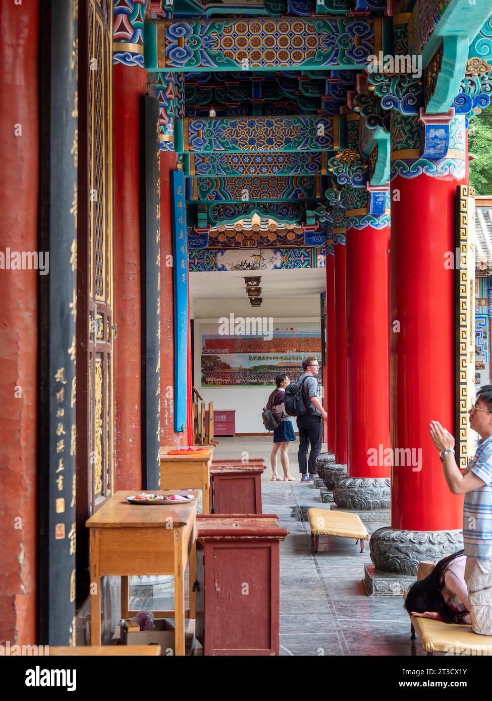 Red columns, praying people, Yuantong Temple, Kunming, Yunnan, China ...