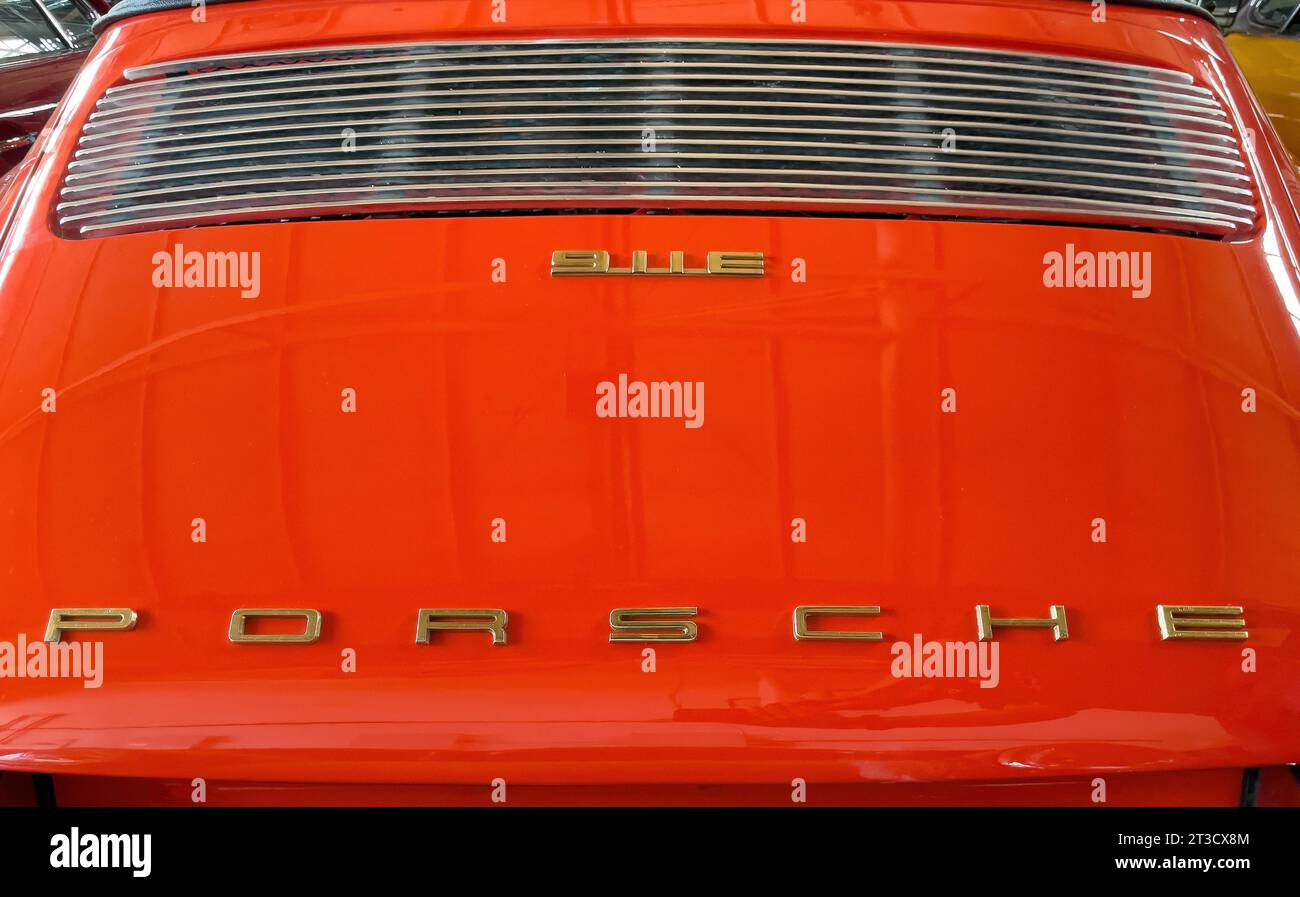 Rear of classic car Porsche 911 E from the 60s in orange colour with ...