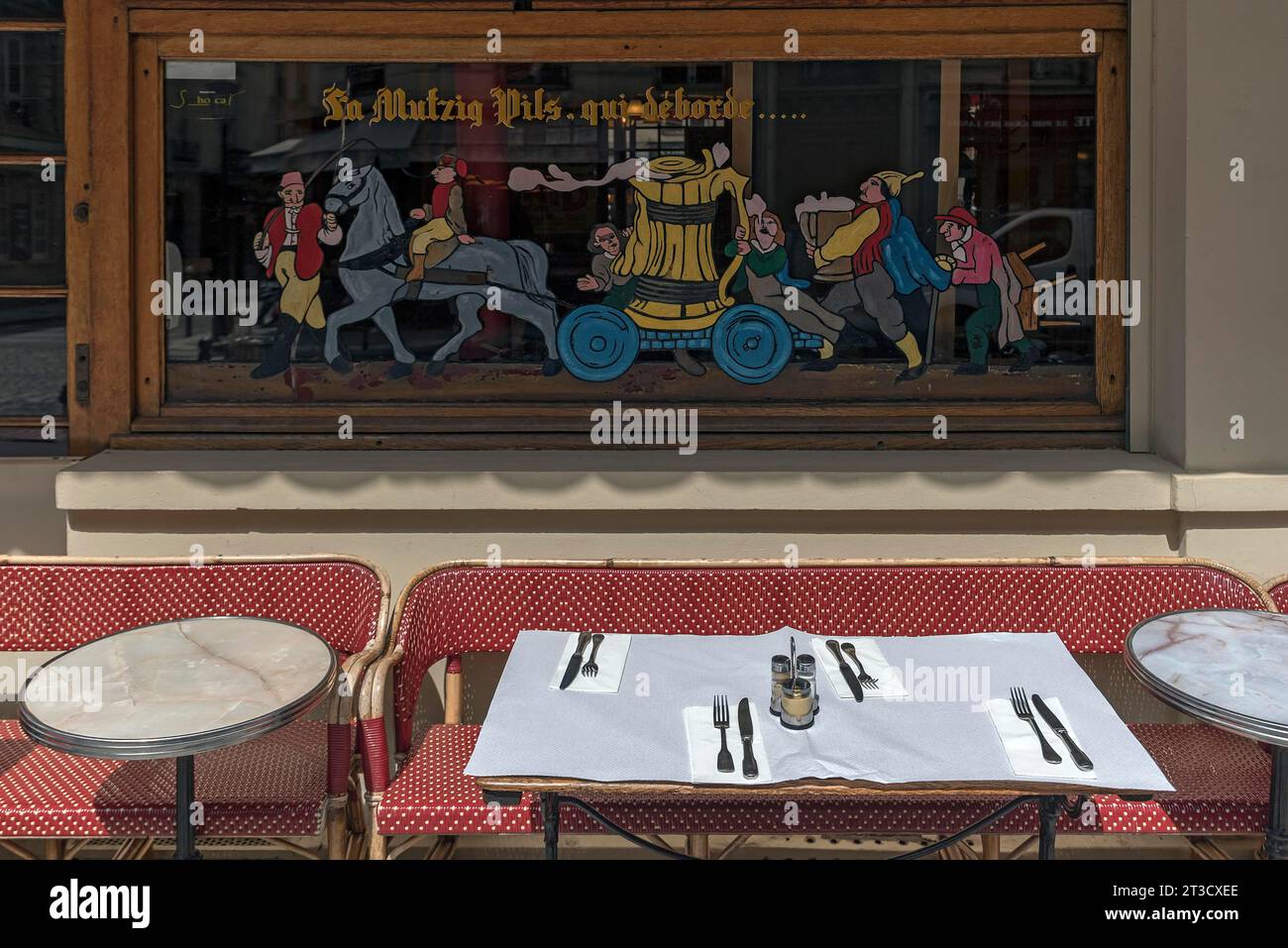 Beer advertisement on a window of a restaurant, in front of it a laid ...