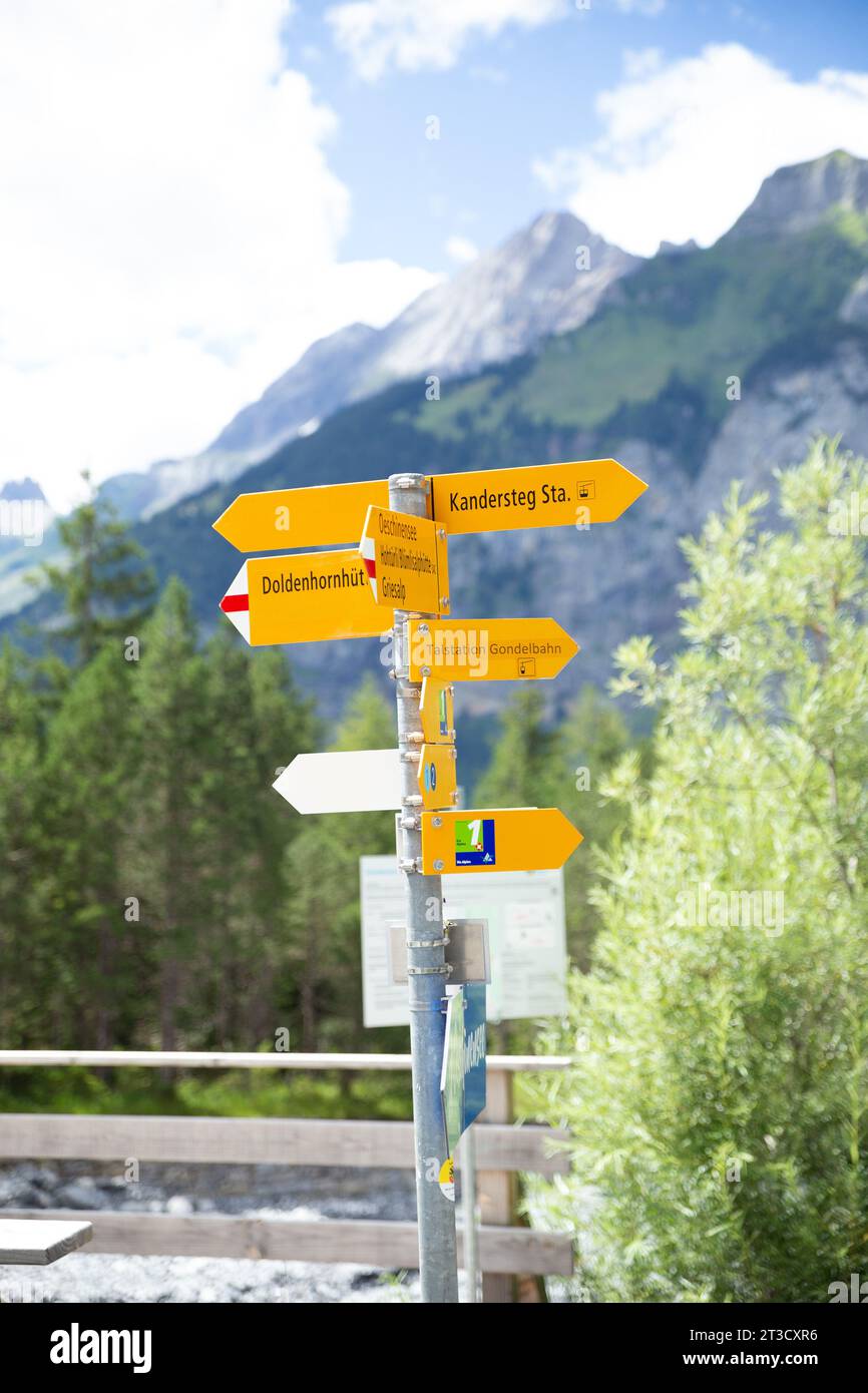 road signs in Alps with Alps rock mountain in the backgournd Stock ...