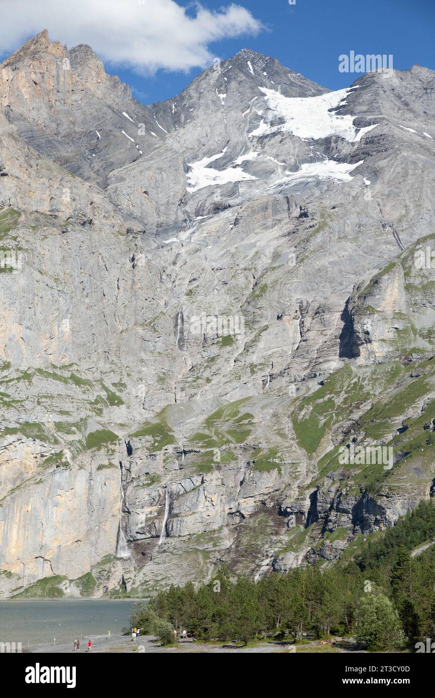 Facade view of Alps rocky mountain with glacier Stock Photo - Alamy