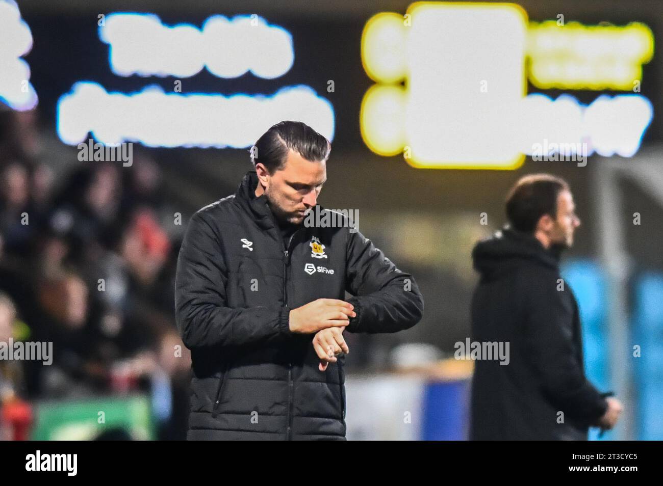 Mark Bonner (Manager Cambridge United) looks at watch late on in the ...