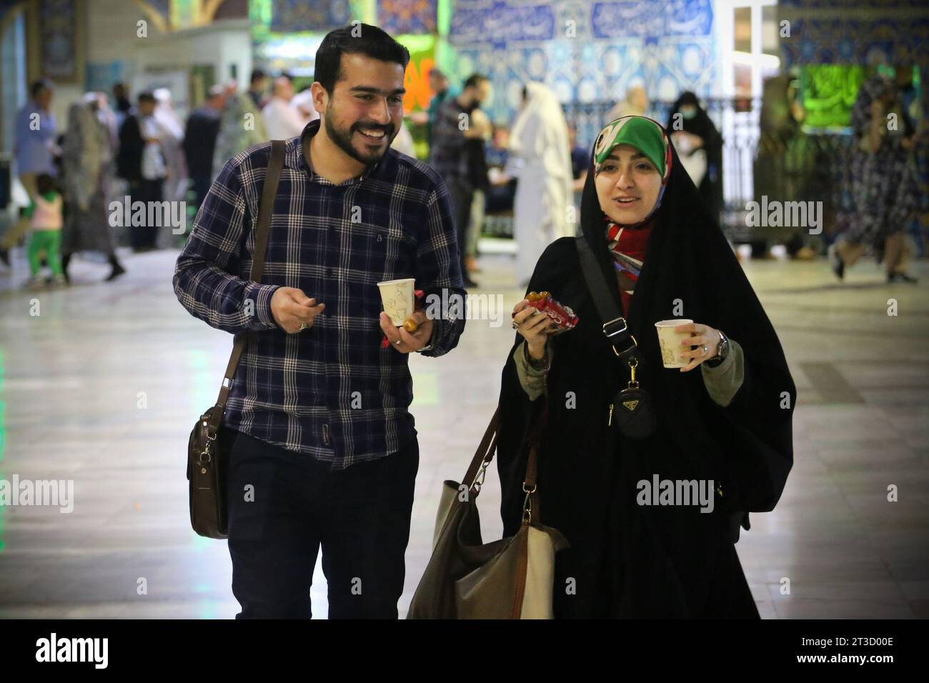 Tehran, Iran. 24th Oct, 2023. A young Iranian couple walks during a ...
