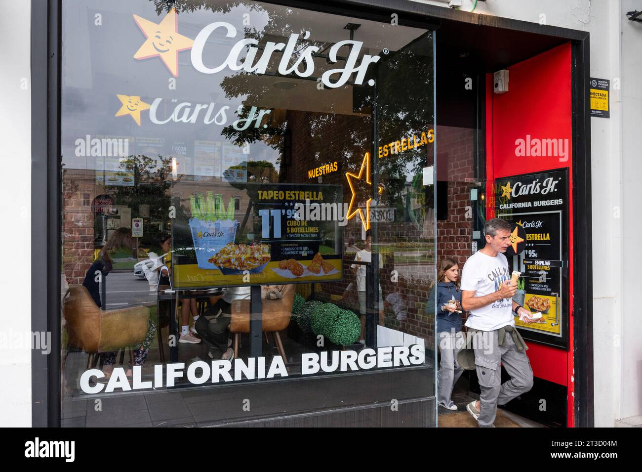 Customers leave the American fast food restaurant chain Carl's Jr ...