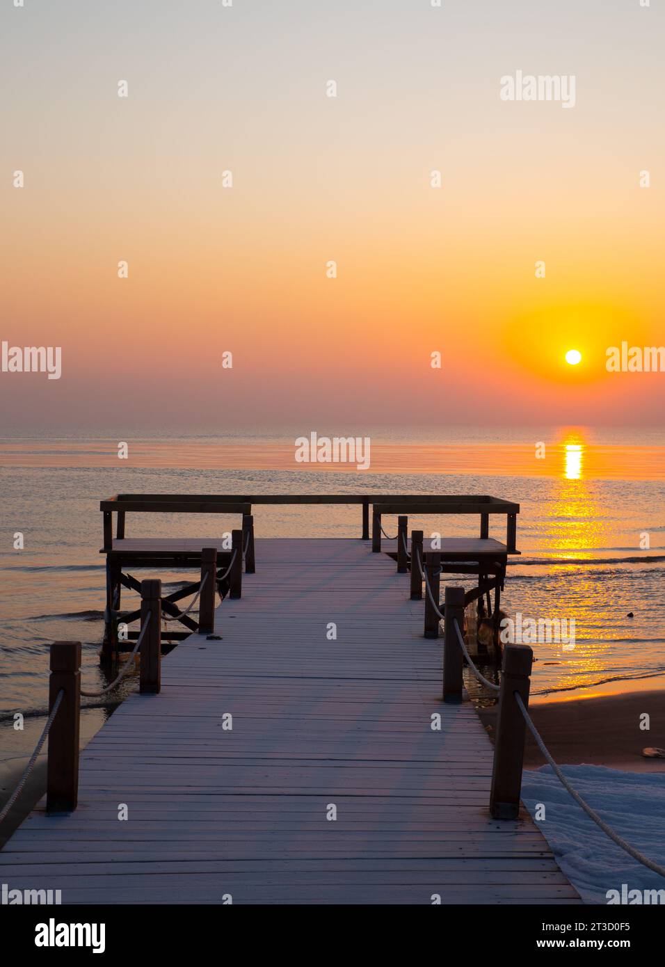 deck on the sea with sunset color in the background Stock Photo - Alamy
