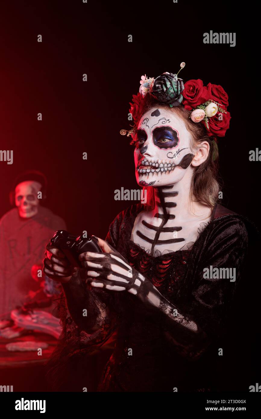 Lady of death playing online video games with joystick on console ...