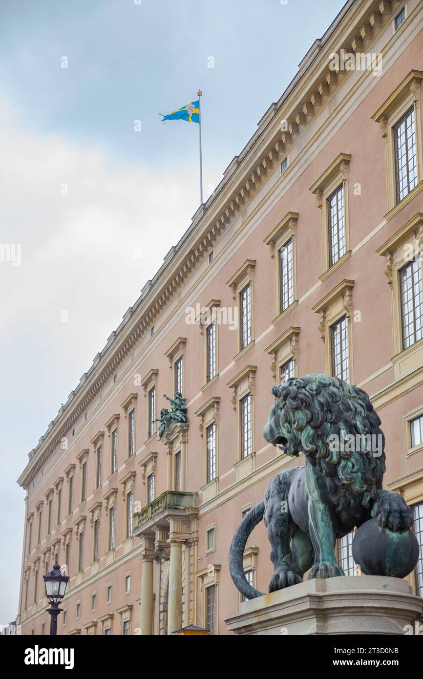 Lion Statue at Royal Palace with swedish national flag in the ...