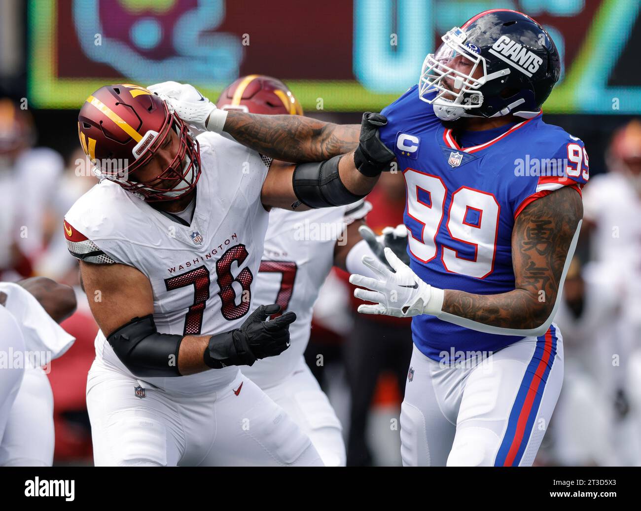 Washington Commanders tackle Sam Cosmi (76) shoving against New York ...