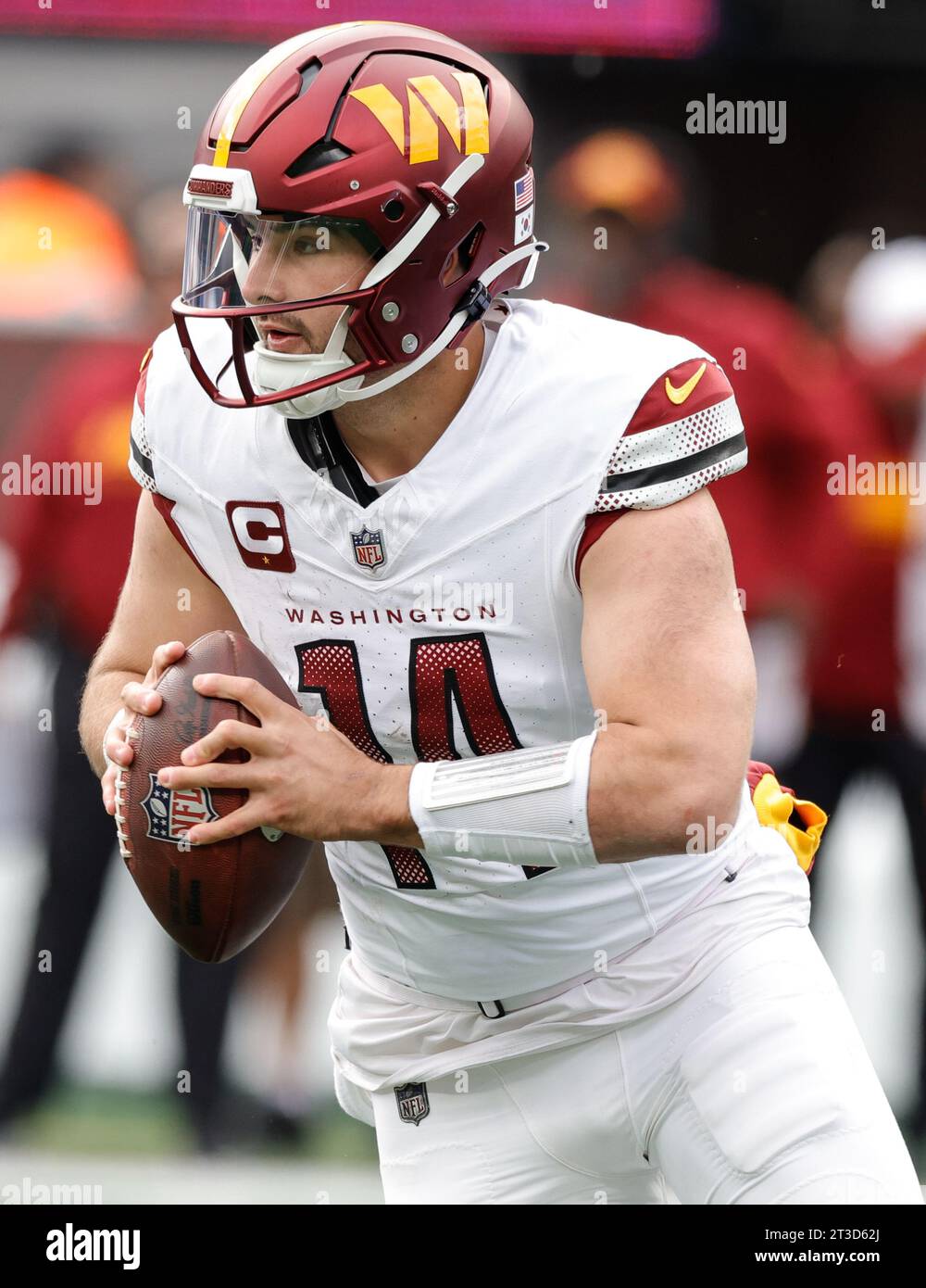 Washington Commanders Sam Howell (14) with the carry of the ball ...