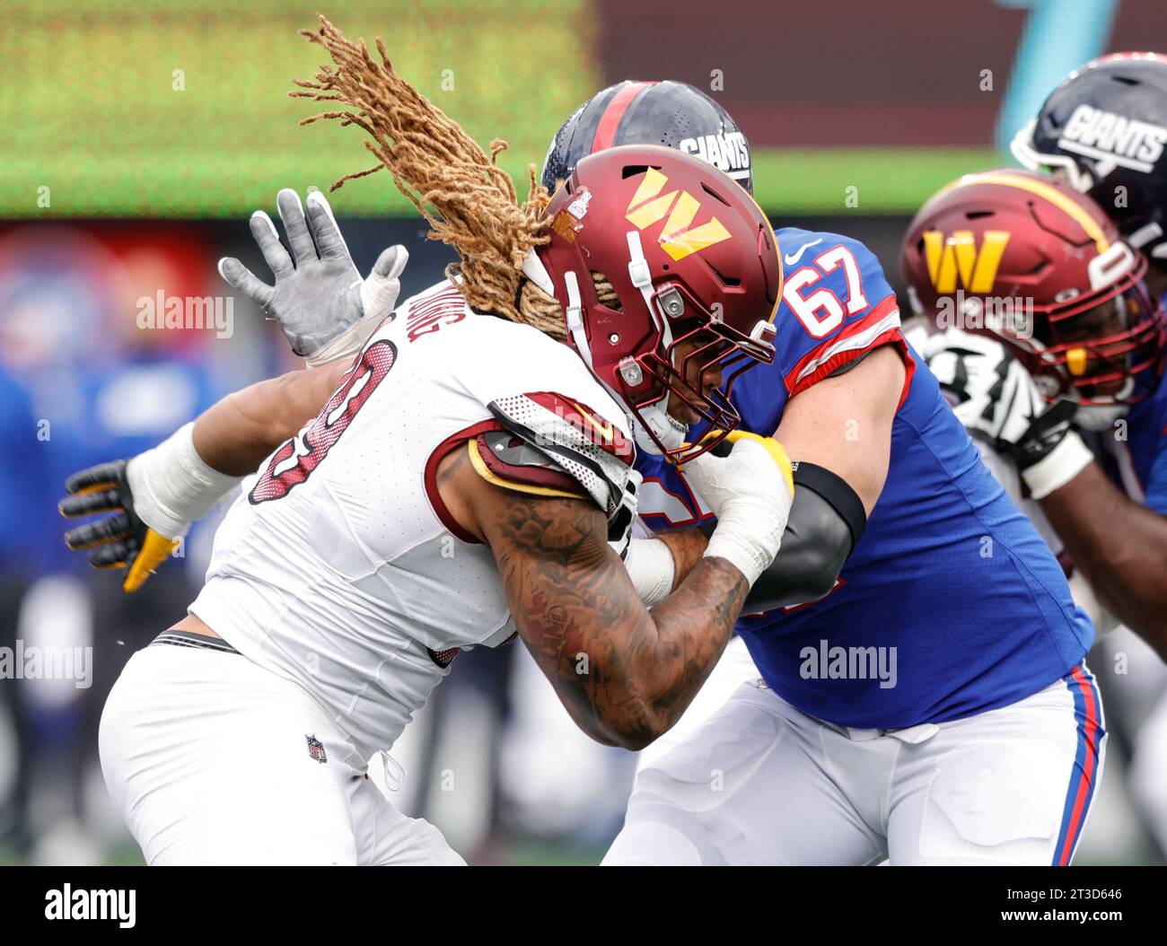 Washington Commanders defensive end Chase Young (99) shoving New York ...
