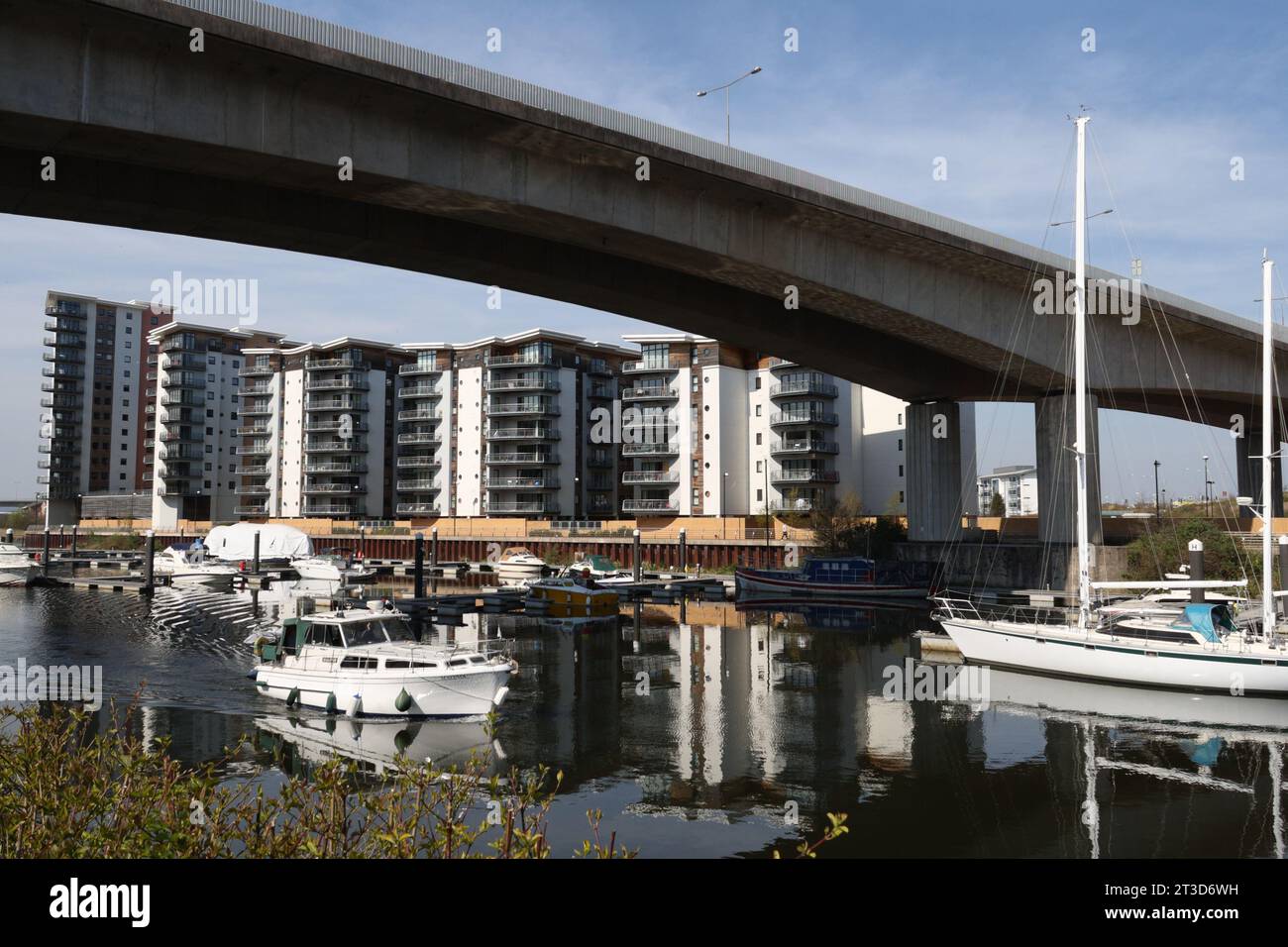 Boats on the River Ely in Cardiff Bay Wales, with modern waterside ...