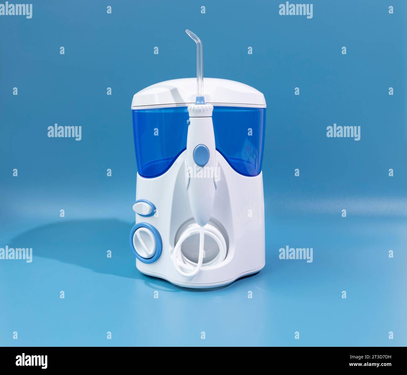 Water Flosser, Dental Oral Irrigator On Blue Background. Dental ...