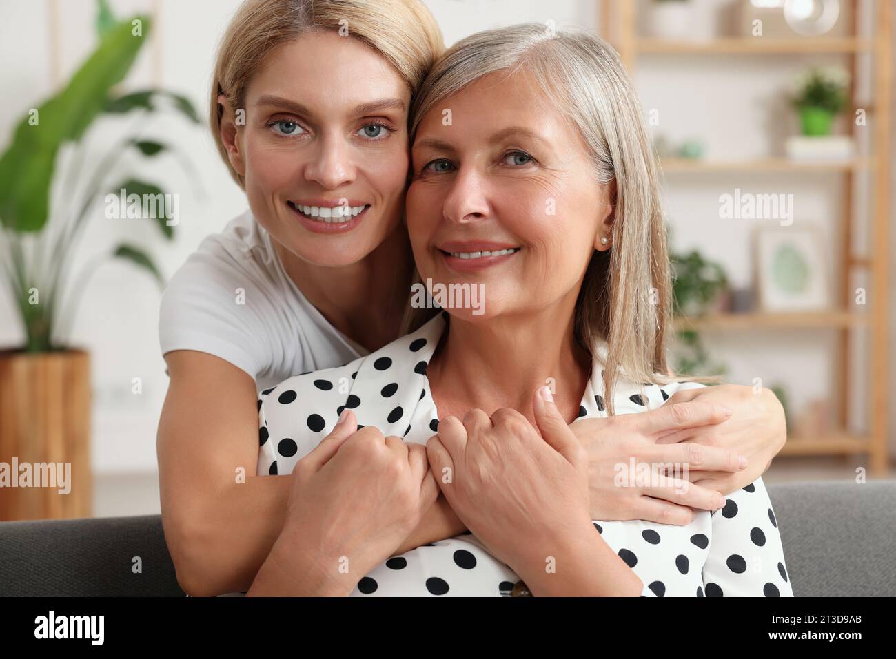 Happy mature mother and her daughter hugging at home Stock Photo - Alamy