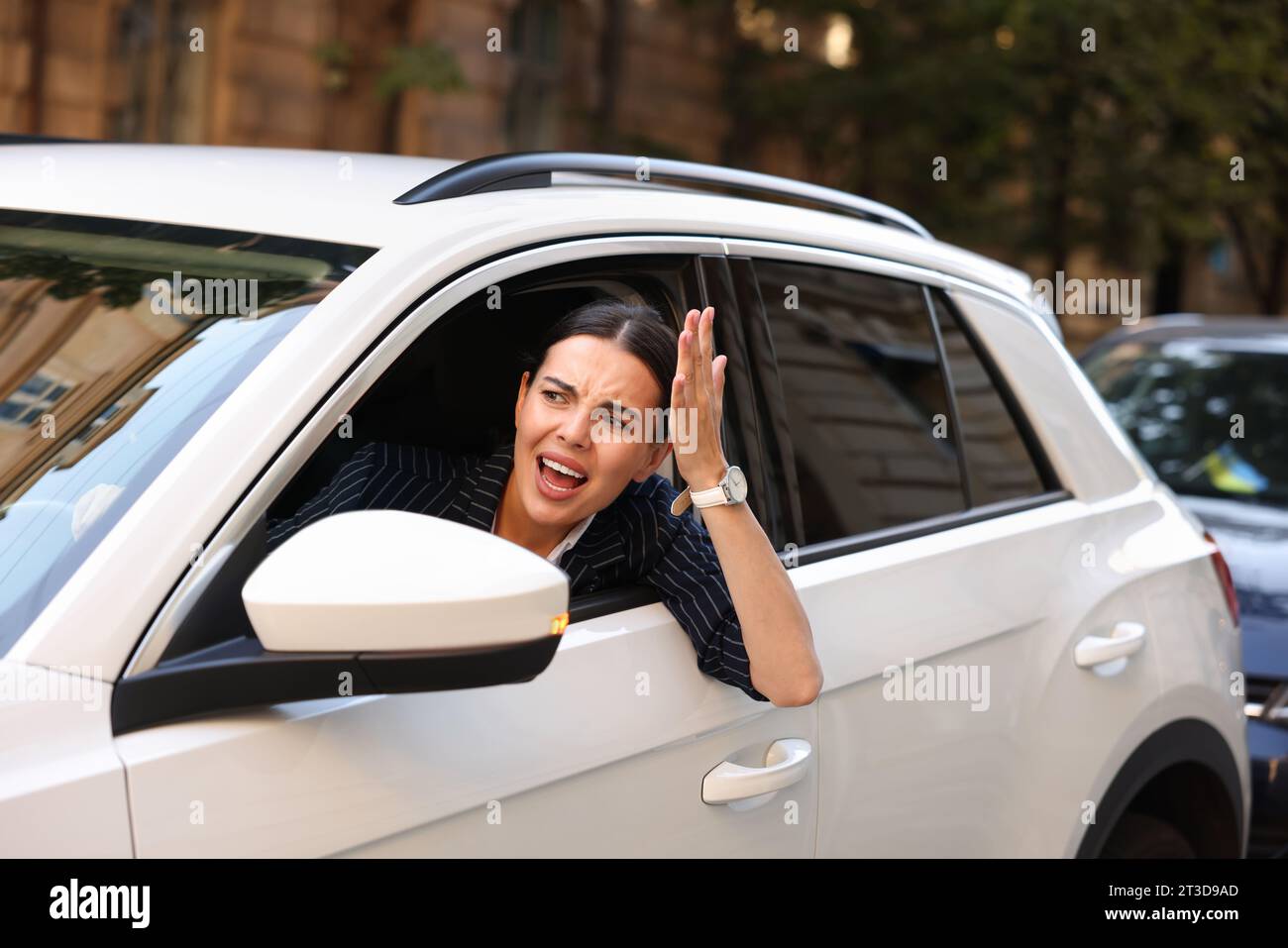 Angry driver screaming at someone from car in traffic jam Stock Photo ...