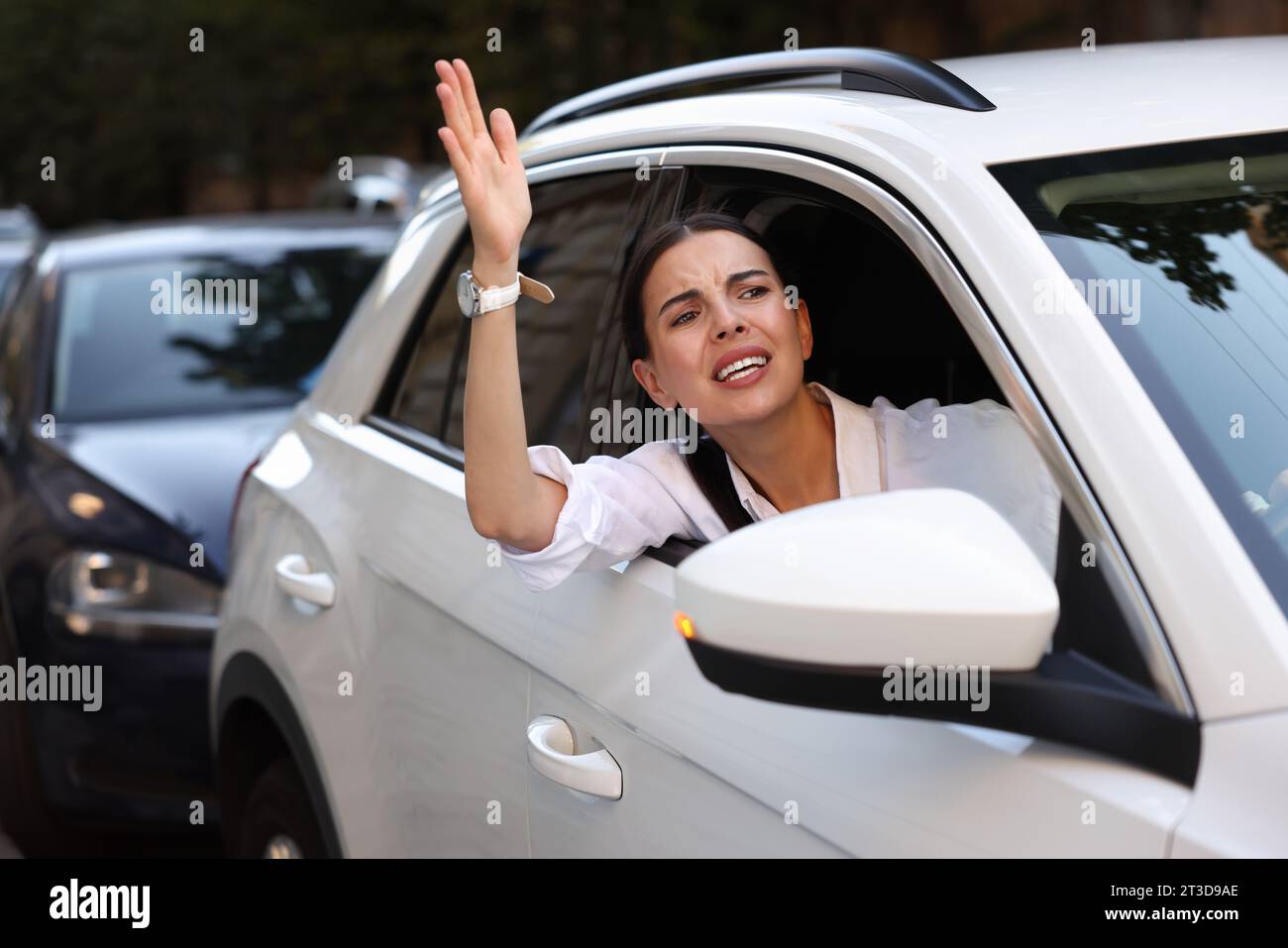 Angry driver screaming at someone from car in traffic jam Stock Photo ...