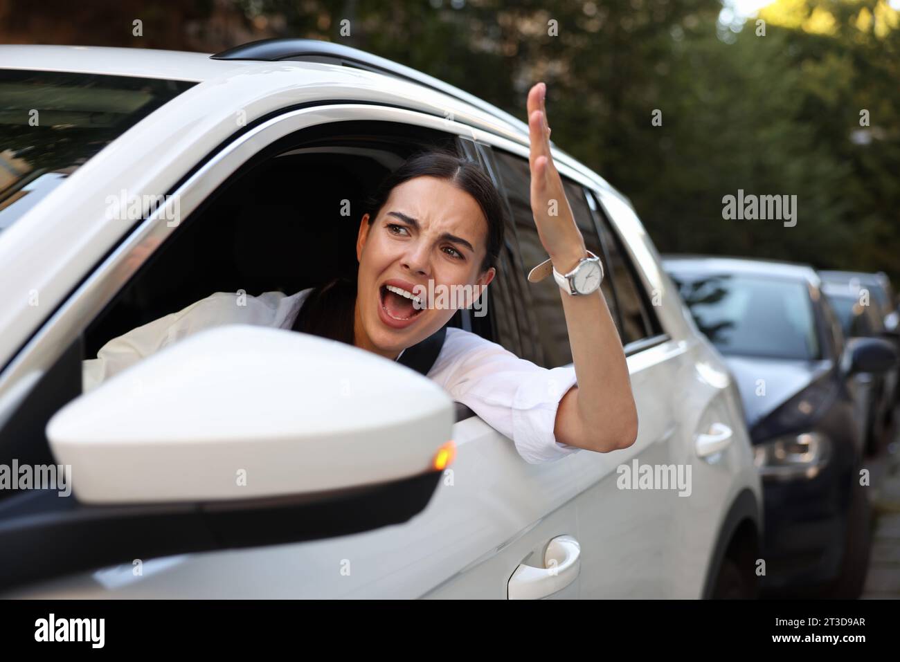 Angry driver screaming at someone from car in traffic jam Stock Photo ...