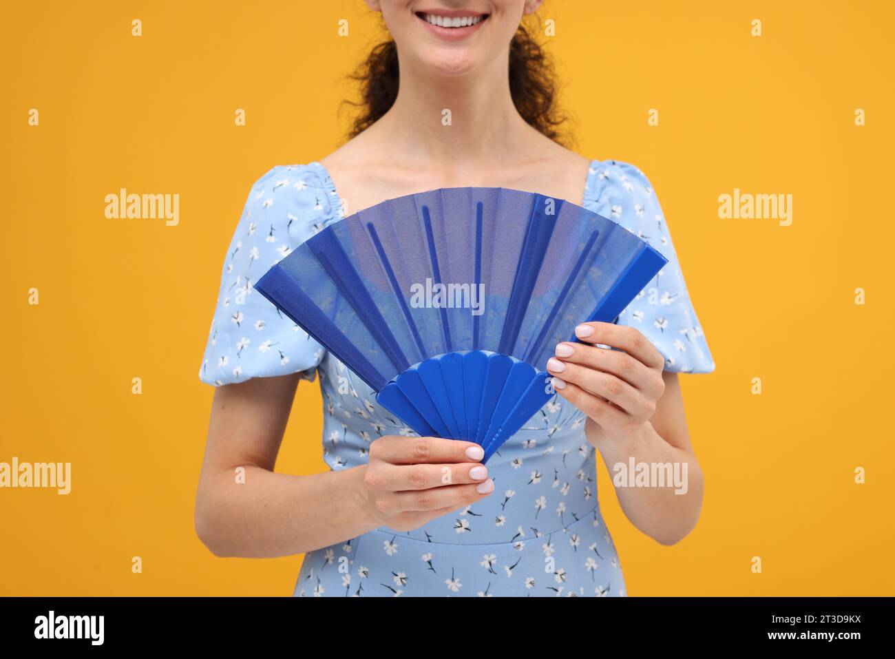 Woman hand fanning in studio hi-res stock photography and images - Alamy
