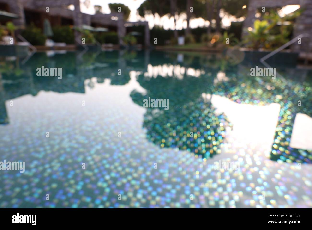 Outdoor swimming pool at resort, blurred view Stock Photo - Alamy