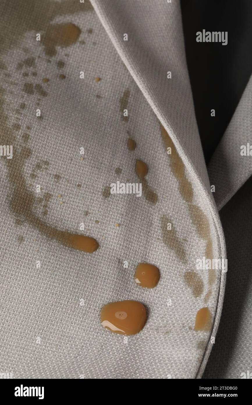 Dirty jacket with stain of coffee as background, closeup Stock Photo ...